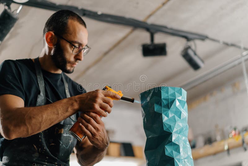 Artisan Sculptor Artist Mixes Using a Gas Burner for Burning Paint and ...