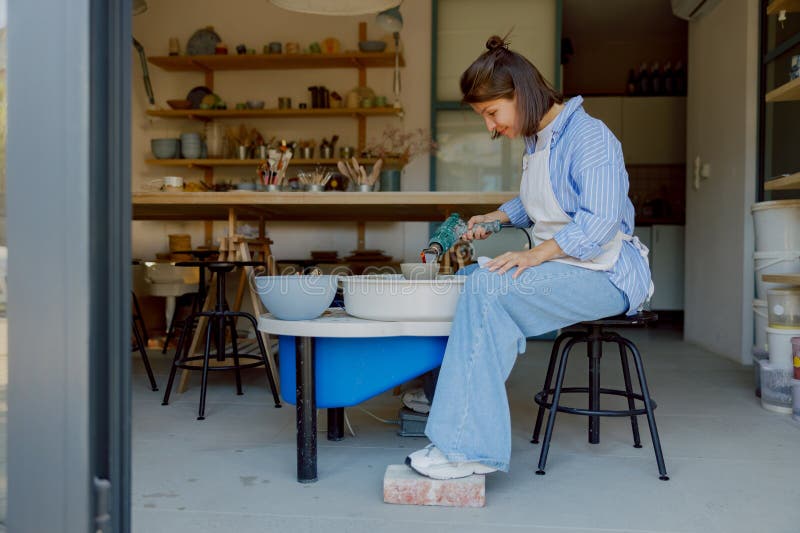 An Artisan Potter Working Diligently in a Beautiful, Creative Studio ...
