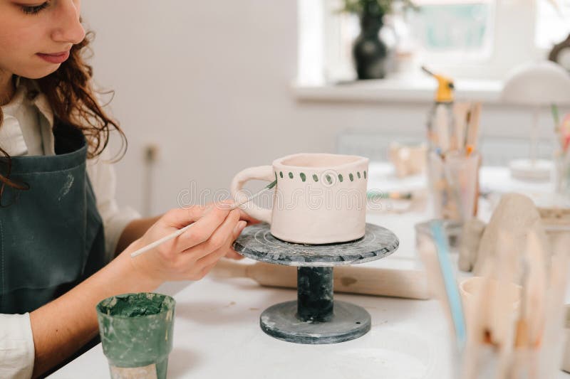 Artisan Stamps Decorative Symbols on the Dry Clay of the Cup. Process ...