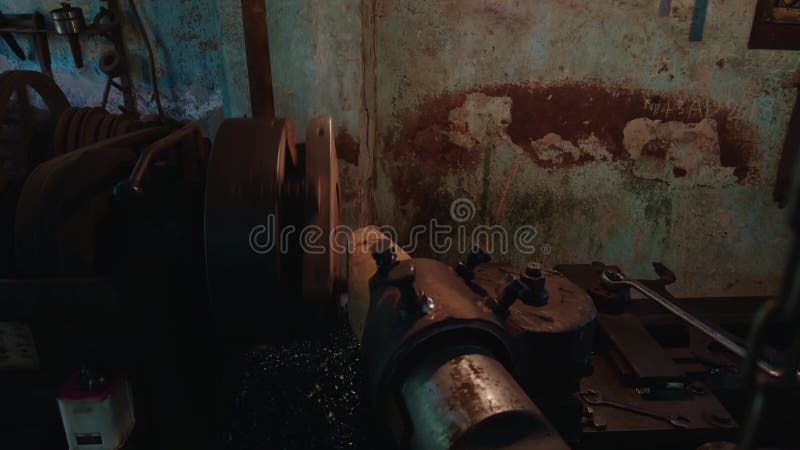 Artisan Using a Lathe Machine in a Rustic Workshop with Tools on the ...