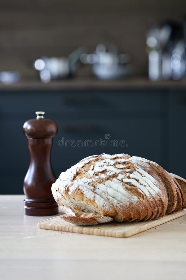 Artisanal Bread Loaf on Wooden Kitchen Board Stock Image - Image of ...