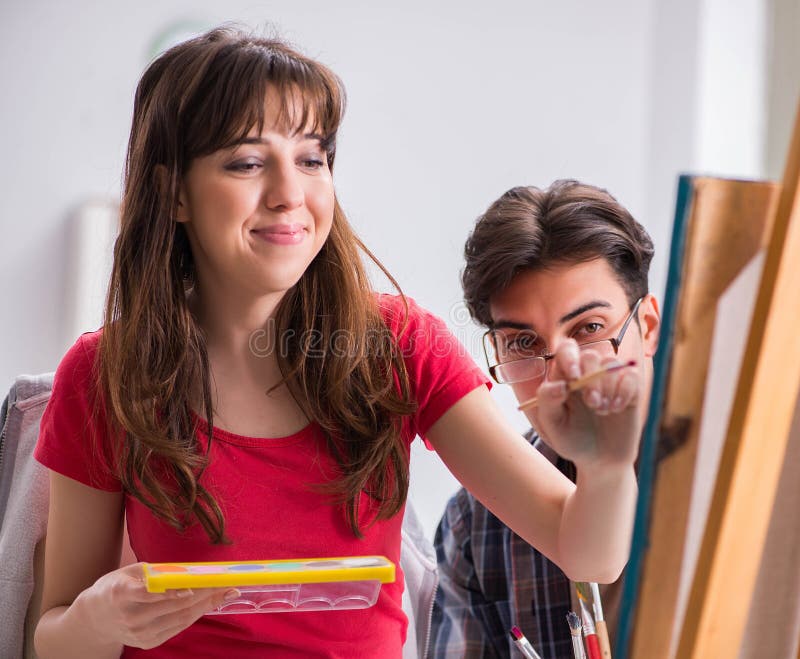 Artist Coaching Student in Painting Class in Studio Stock Photo - Image ...