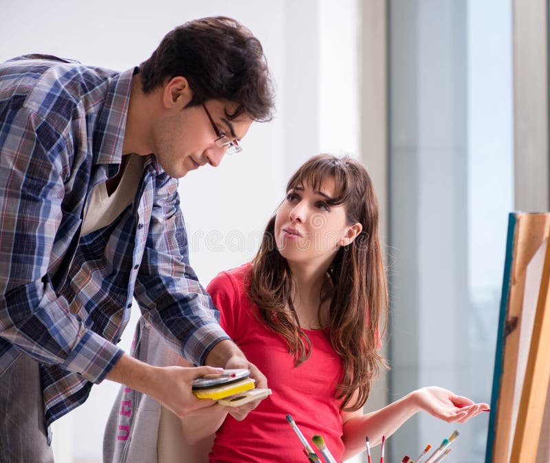 Artist Coaching Student in Painting Class in Studio Stock Photo - Image ...