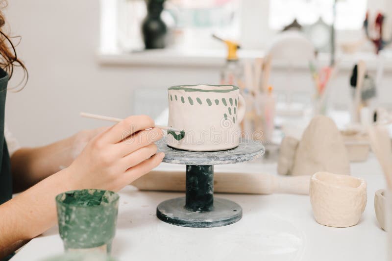 Artist is Decorating and Painting Handmade Ceramic Clay Cup in the ...