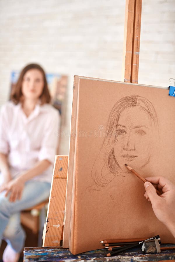 Artist Drawing Portrait of Beautiful Model in Art-Studio Stock Image ...
