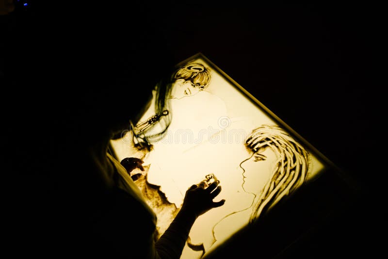 The Artist Draws Sand. Animation on the Sand Editorial Image - Image of ...