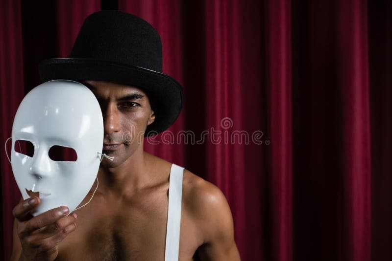 Artist holding white mask stock image. Image of opera - 98001353