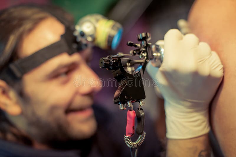 Artist Making Tattoo on Male Customer Stock Photo - Image of ...