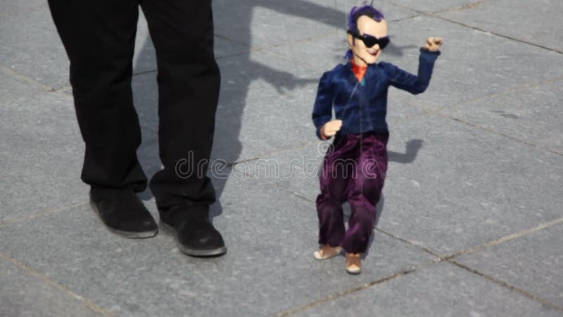 Artist Manages Puppet Which Dance on Pavement at Stock Footage - Video ...
