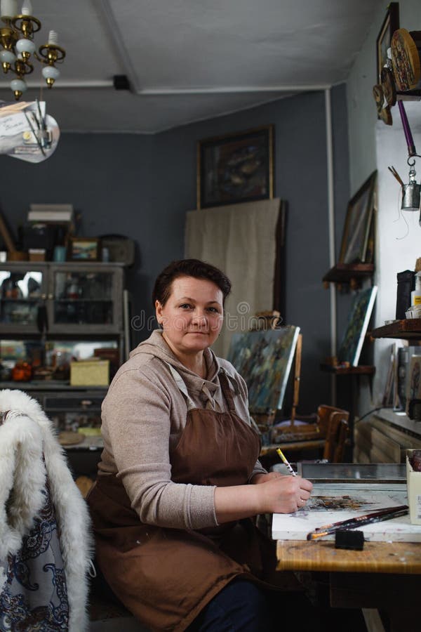 The Artist Paints on Canvas, Performing Art Projects in Her Studio ...