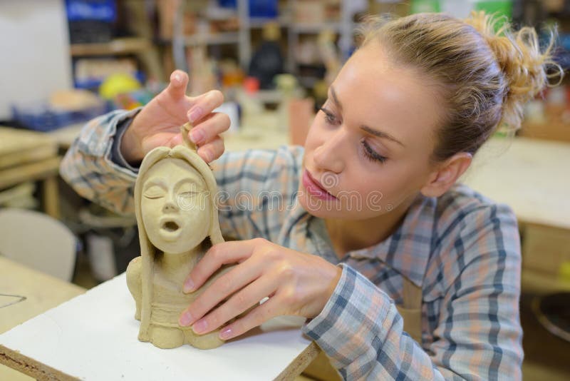 Artist perfecting figure stock image. Image of plaster - 261513803