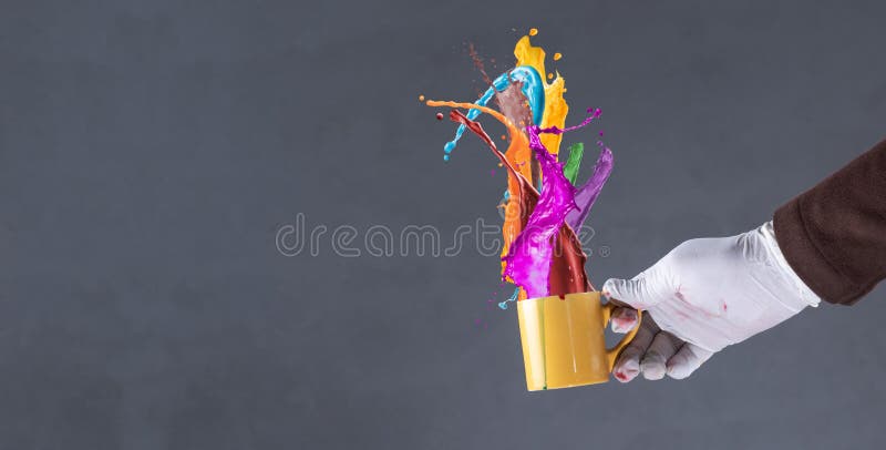 Artist Throwing Multi Colored Paint Splash from Cup To the Wall ...
