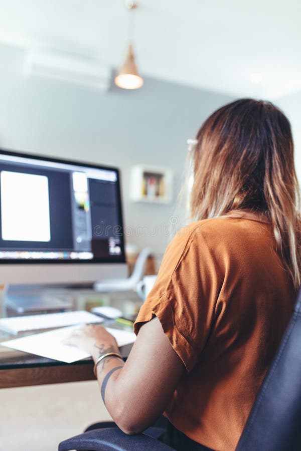 Artist Working on Computer at Office Stock Photo - Image of drawings ...