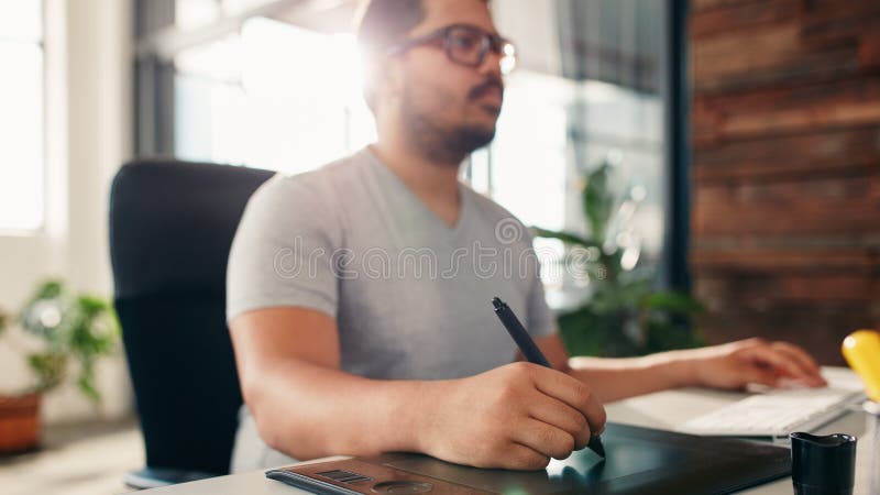 Man Using Mobile Phone at Desk in Busy Creative Office Stock Photo ...