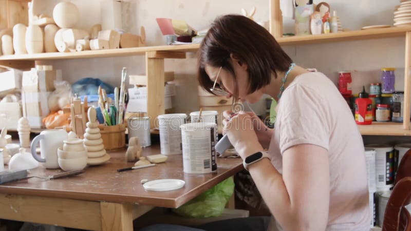 The Artist in the Workshop is Working on Drawing Drawings on Blanks ...