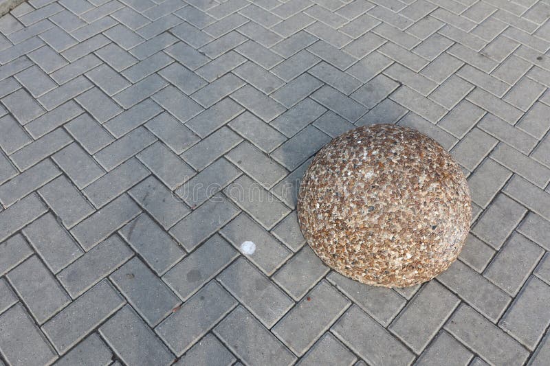 An Artistic and Abstract Representation of a Round Stone Placed on a ...