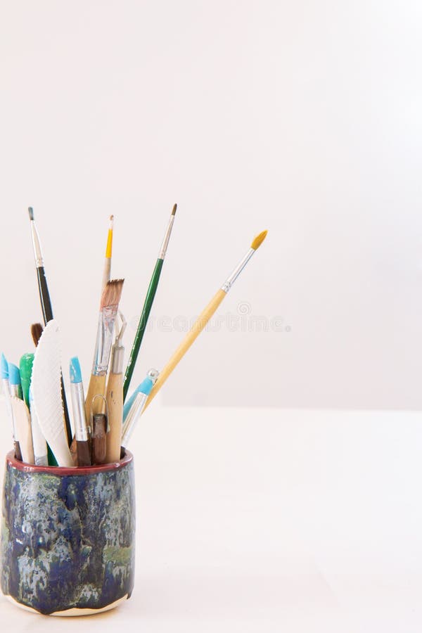 Artistic Brushes in a Jar on a Light Background. Artist Tool Stock ...