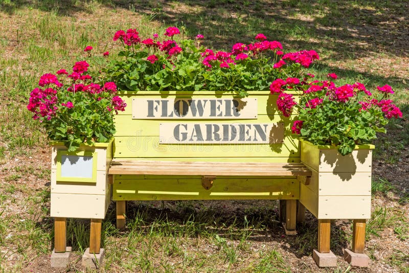 Artistic Garden Bench with Geranium Flowers Stock Photo - Image of ...
