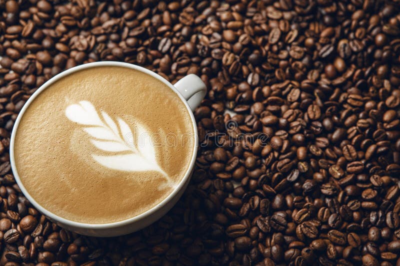 Artistic Latte with Leaf Pattern Surrounded by Coffee Beans Stock Image ...