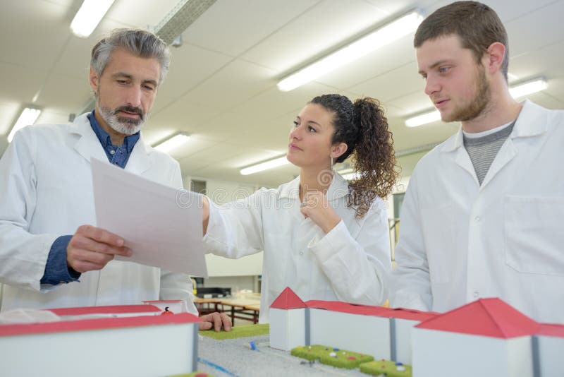 Artistic Positive Students Working on New Exciting Project Stock Photo ...