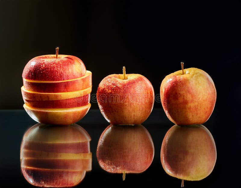 An Artistic Row of Stacked Apples from Smallest To Largest on a Smooth ...