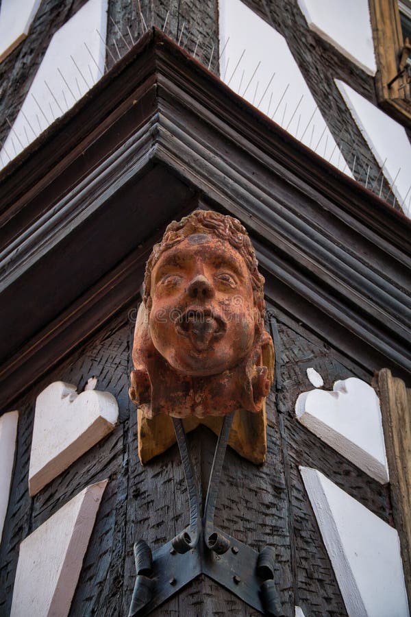 Artistic Sculpture of a Human Face Displayed on the Side of a Building ...