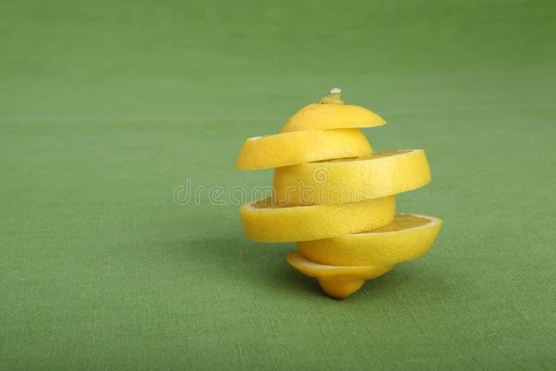 Artistic Structure Made of Lemon Slices on Green Background Stock Photo ...