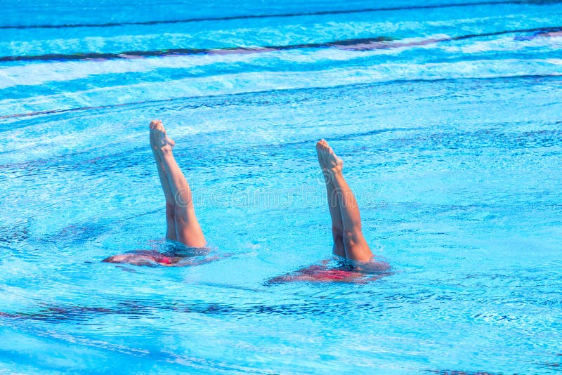 Artistic Swimming Duet Performing Synchronized Legs Movement in ...