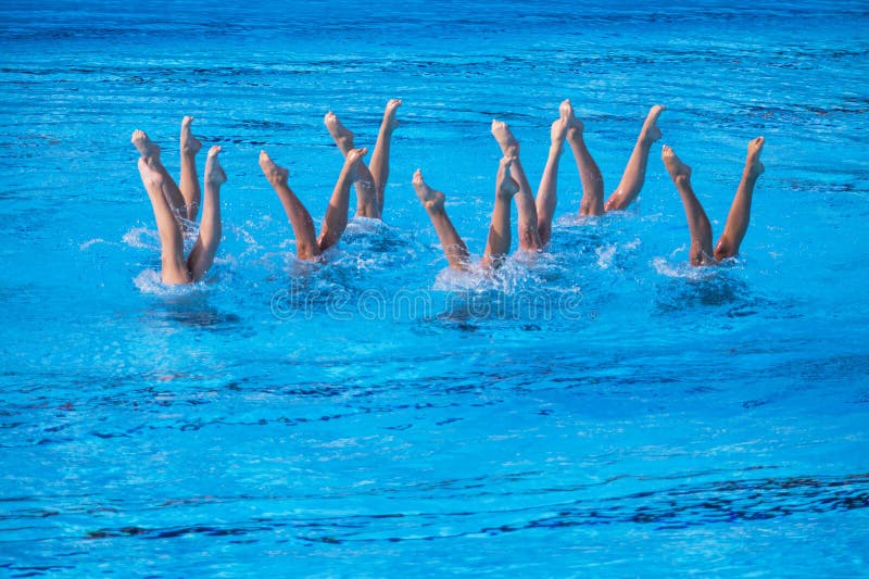 Artistic Swimmers Team Performing Synchronized Legs Choreographed ...