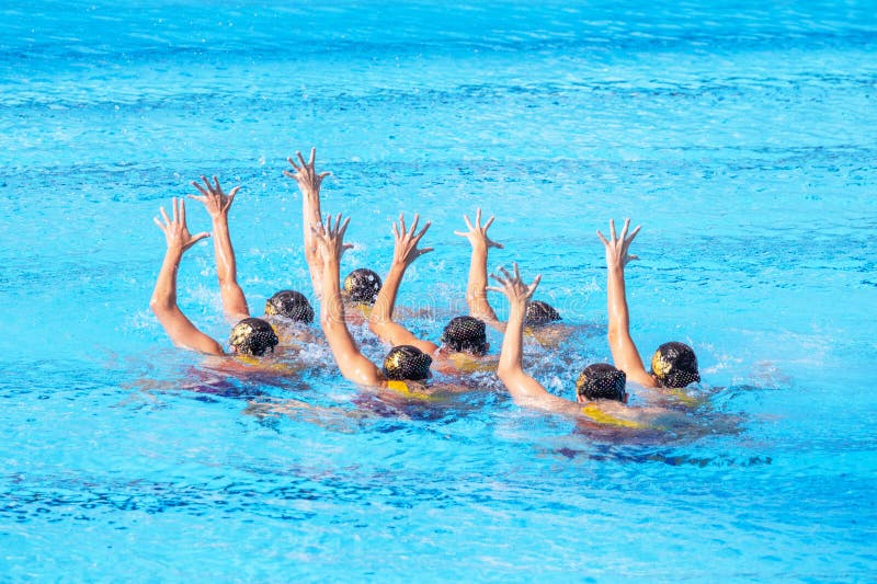 Artistic Swimming Team Performing Synchronized Choreographed Routine in ...