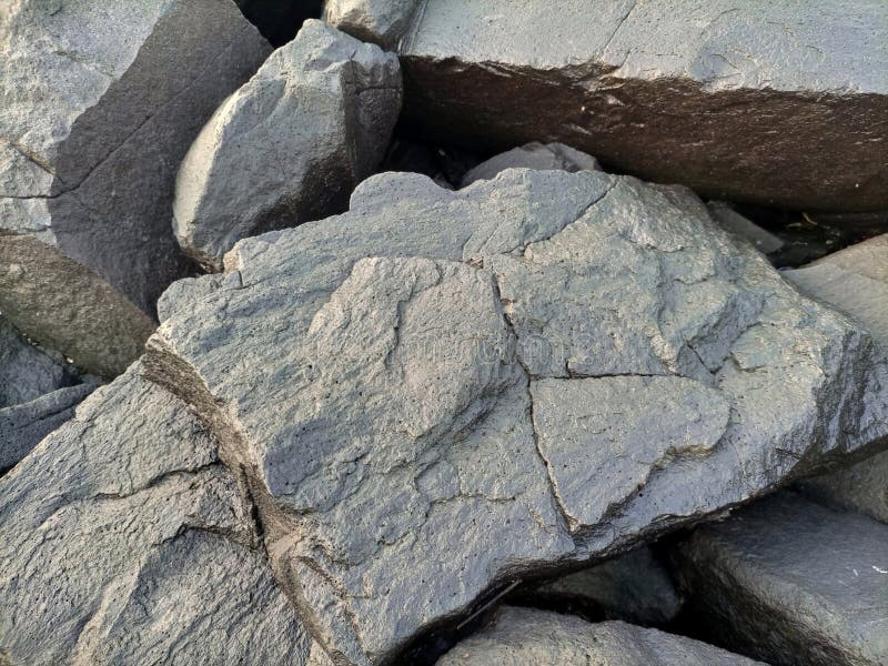 Artistic Texture of a Large, Rough Rock Surface on the Beach Stock ...