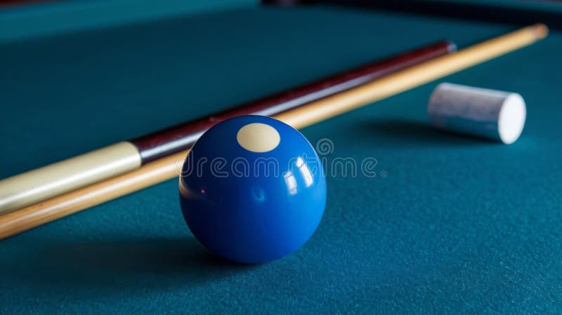 Artistic View of a Pool Ball with a Cue Stick and Chalk on a Felt Table ...