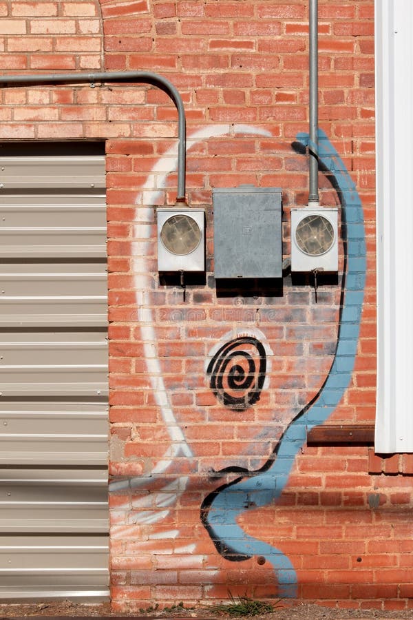 Artwork Around Meter Boxes on Red Brick Wall Stock Photo - Image of ...