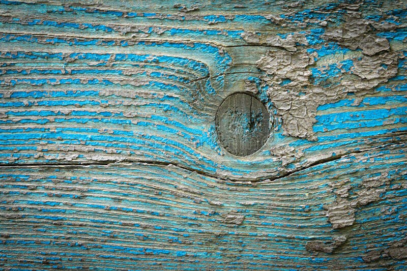 A Close-up of Weathered Wood Showcasing Vibrant Blue Paint Patterns and ...