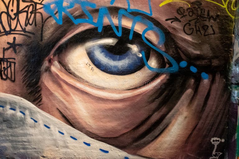 Graffiti Art Features a Large, Detailed Eye with a Bright Blue Iris on ...