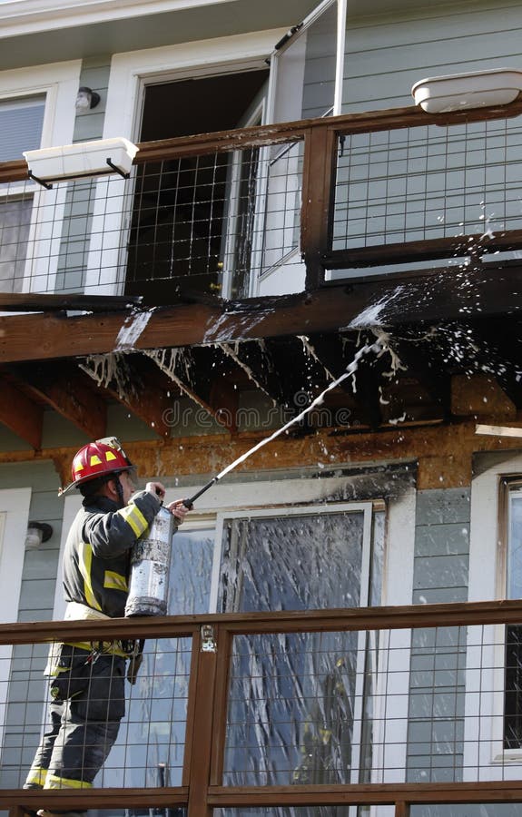 Arvada Fire Fighter Puts Out a Deck Fire Editorial Stock Photo - Image ...