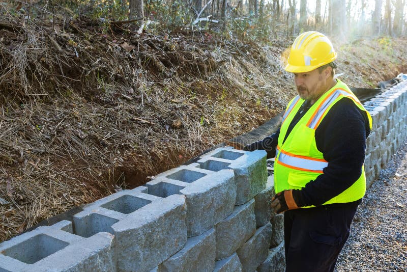 As Construction Worker Mounting Retaining Wall from, Concrete Block ...