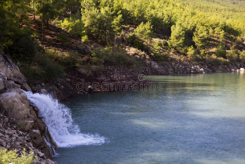 As the Water Source from the Mountain Spills into the Lake Stock Image ...