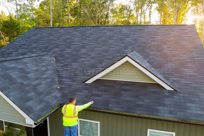 As Worker is Cleaning Clogged Roof Gutter Drain from Dirt, Debris ... As Worker is Cleaning Clogged Roof Gutter Drain from Dirt, Debris ...