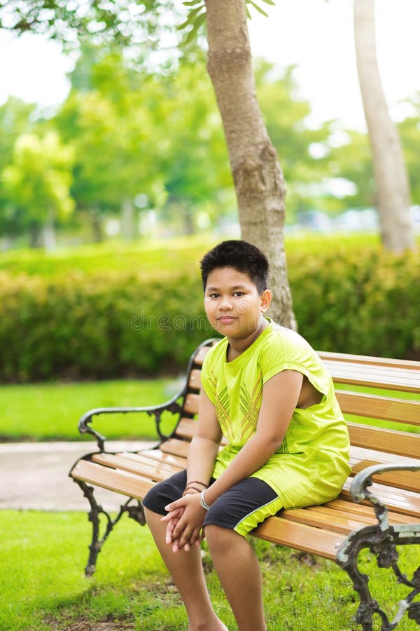 Asain Cute Little Boy Sitting with Green Nature Stock Image - Image of ...