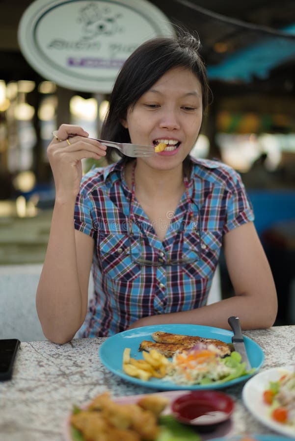Asain Women Eating Salmon Steak Stock Image - Image of eating, people ...