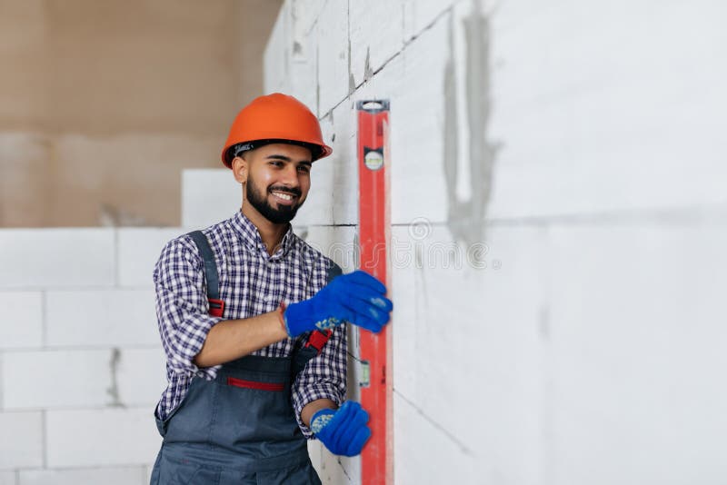 Asain Worker Using Water Level Meter Measuring the Wall Builder Working ...