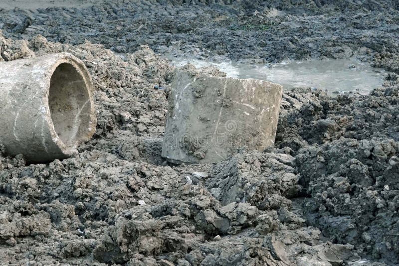 An Asbestos Cement Pipe in the Mud of a Construction Site Stock Photo ...