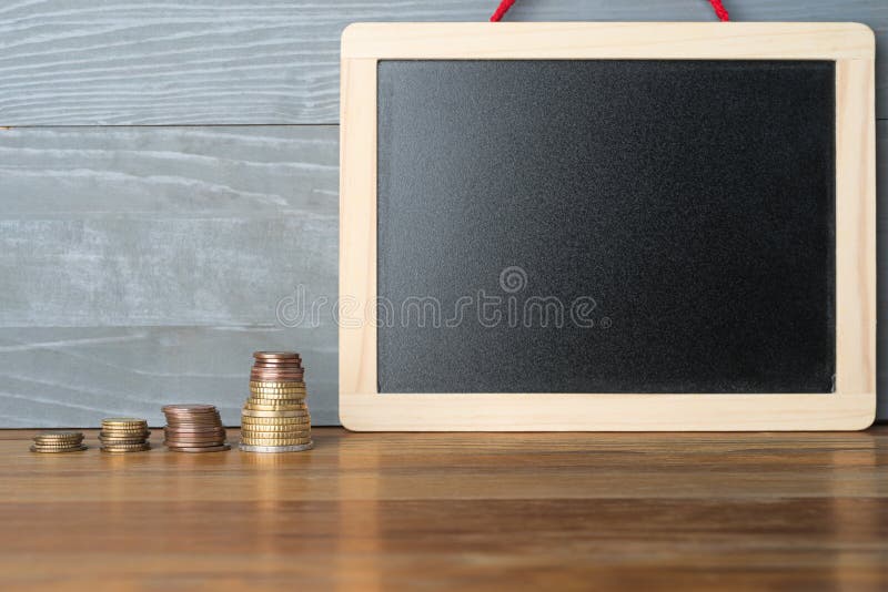 Ascending Stacks of Coins with Blank Blackboard Stock Photo - Image of ...