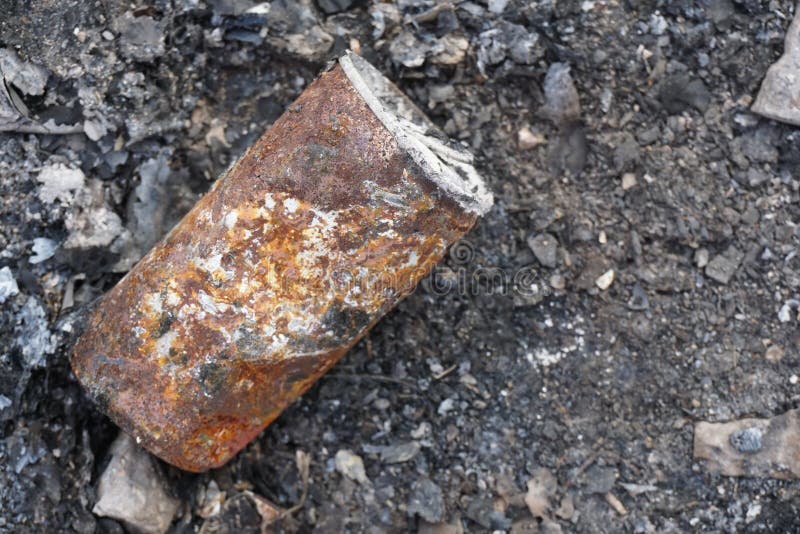 Ash and can on the ground stock image. Image of ground - 151850191