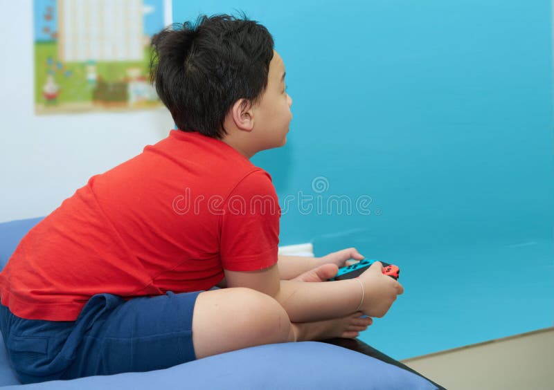 Asia Boy Use Joystick Controller Play Game in Room House Stock Photo ...