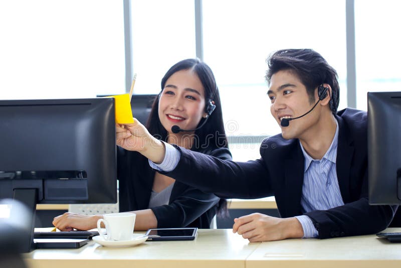 Asia Group of Call Center Workers or Confident Business Team with ...
