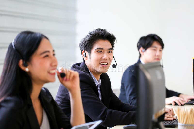 Asia Group of Call Center Workers or Confident Business Team with ...