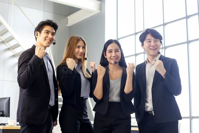 Asia Group of Call Center Workers or Confident Business Team with ...