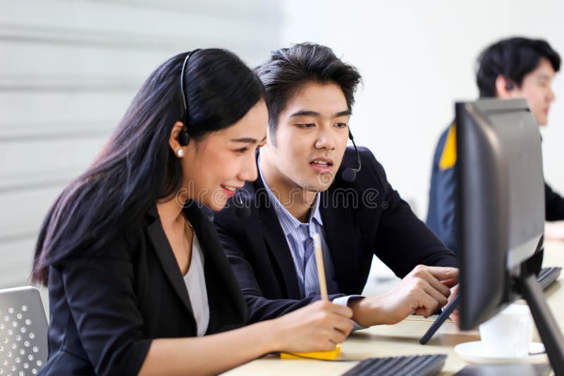 Asia Group of Call Center Workers or Confident Business Team with ...
